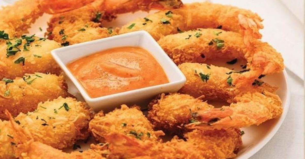 Deliciosos camarones empanados con coco y salsa de mango